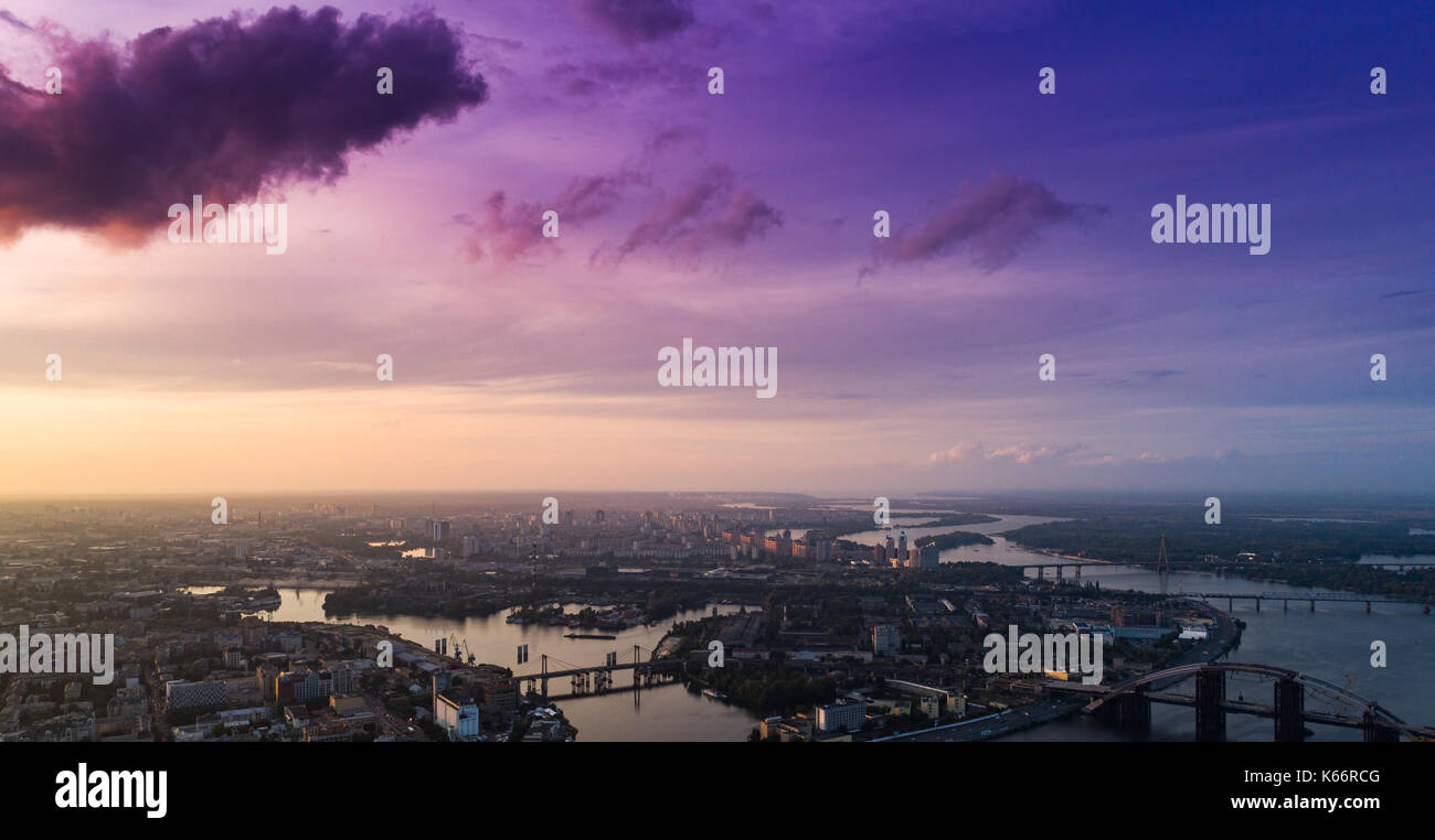 Panoramic view of a modern city with a river, unfinished bridge and ...