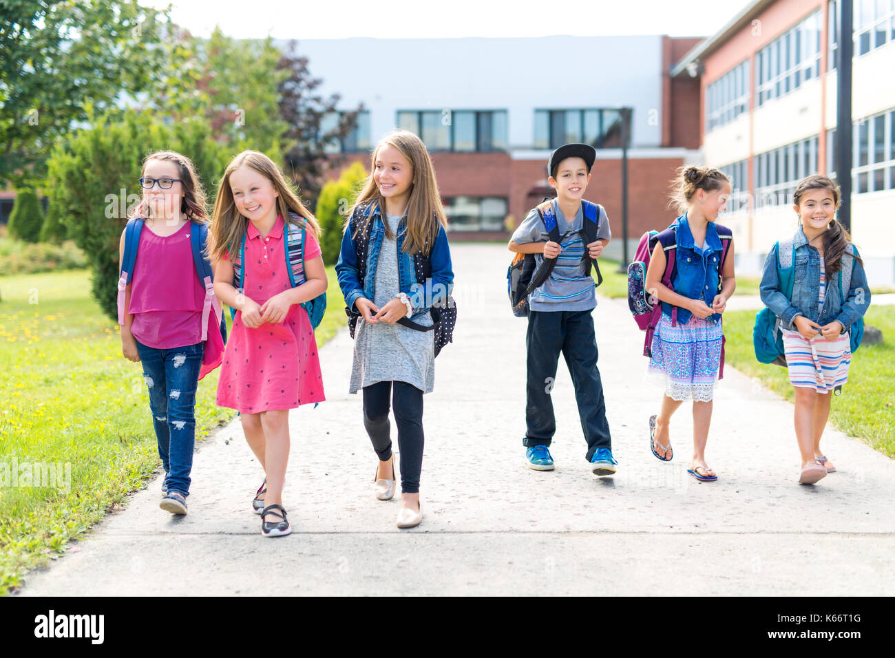 Great Portrait Of School Pupil Outside Classroom Carrying Bags Stock ...