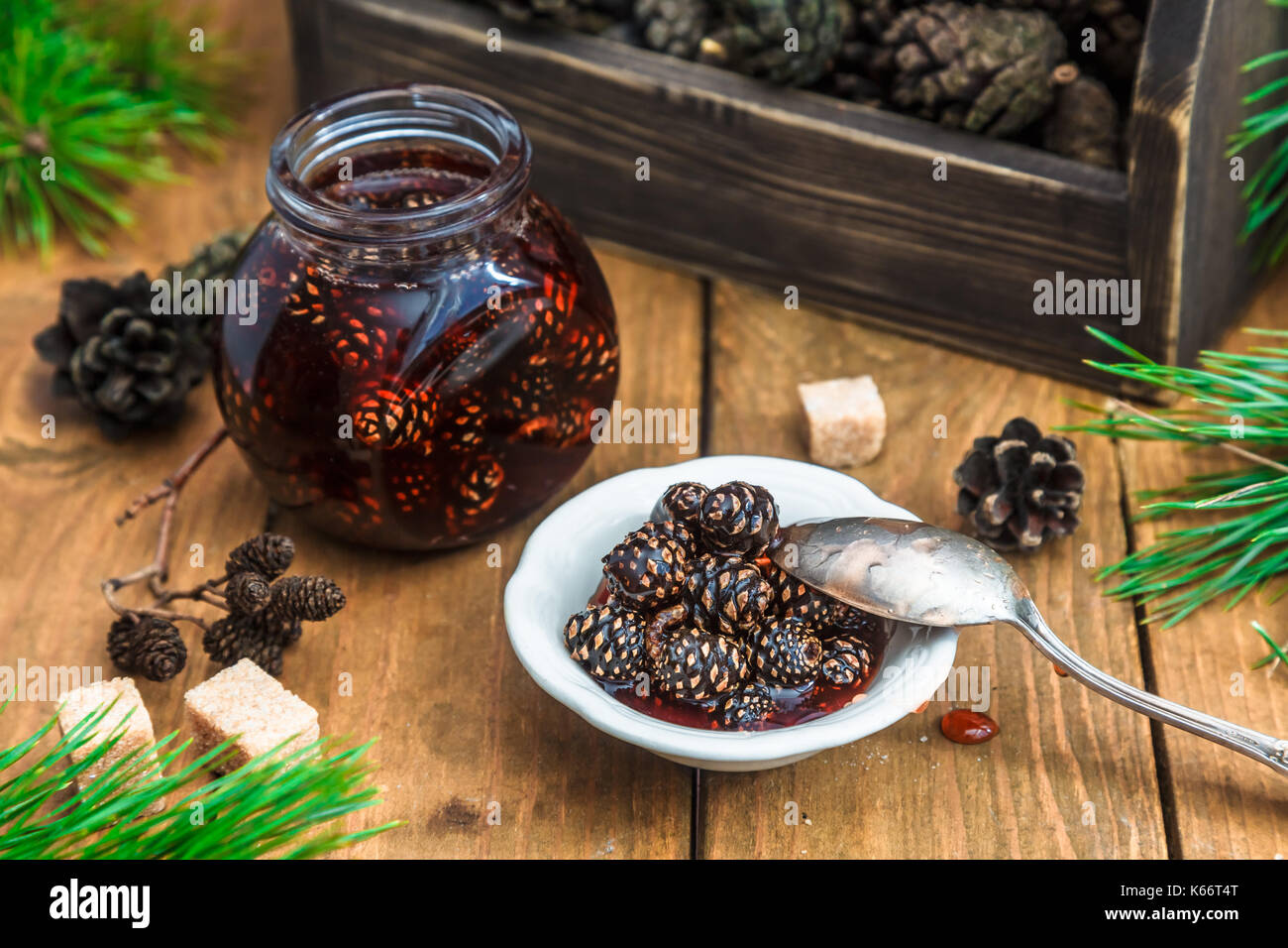 Traditional Siberian sweets: young pine cones jam Stock Photo - Alamy