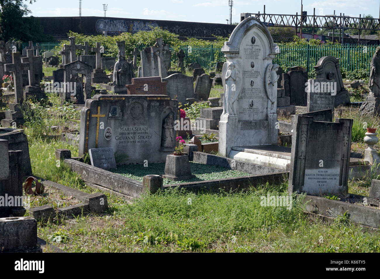 Graves with the fence around the railway tracks at Saint Mary's ...