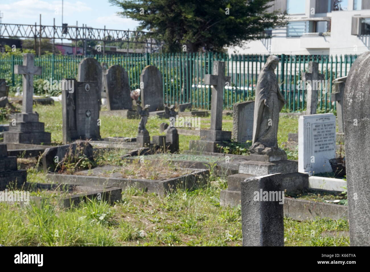 Graves with the fence around the railway tracks at Saint Mary's ...