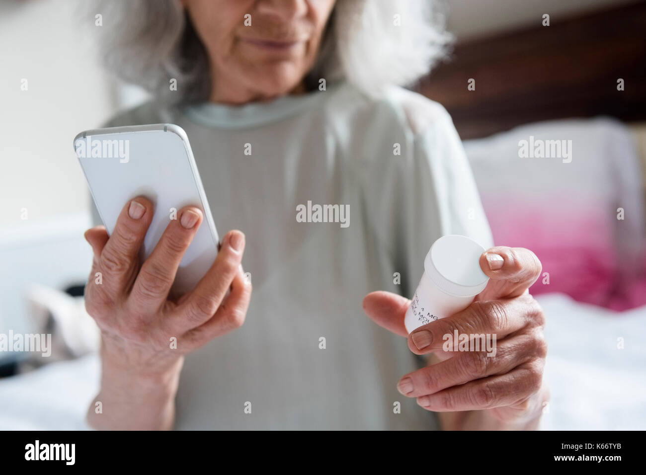 Older woman checking prescription with cell phone Stock Photo - Alamy