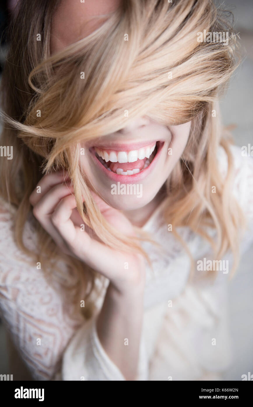 Face close up hair covering eye hi-res stock photography and images - Alamy