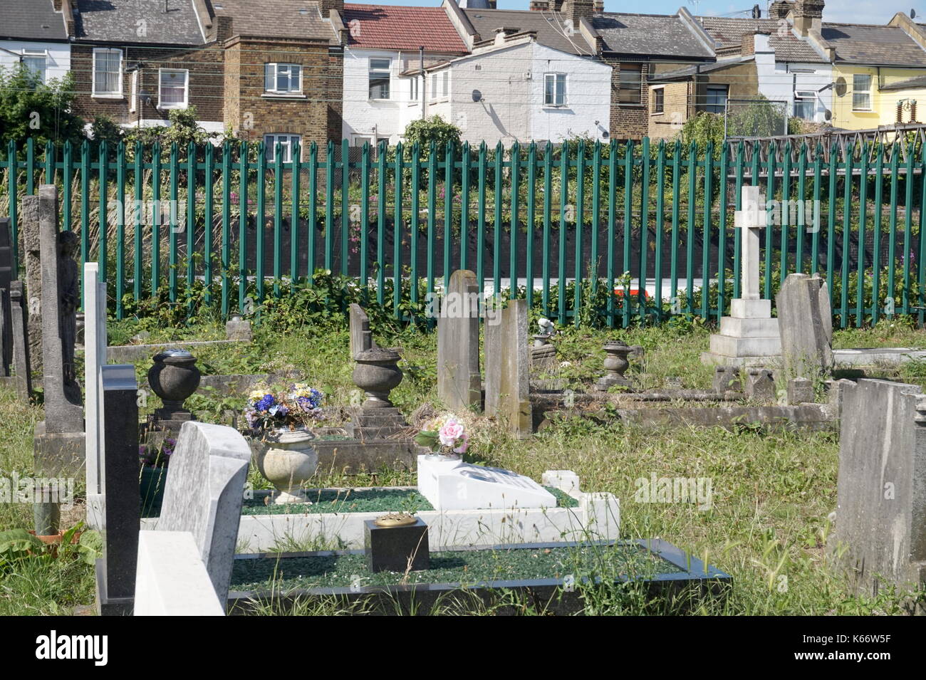 Graves with the fence around the railway tracks at Saint Mary's ...