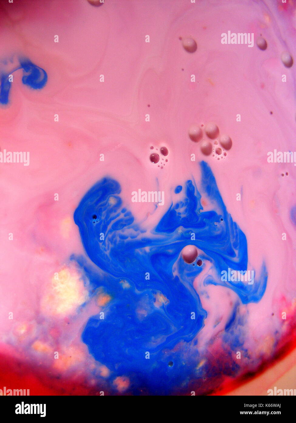 Liquid water and oil drops in milk Stock Photo - Alamy