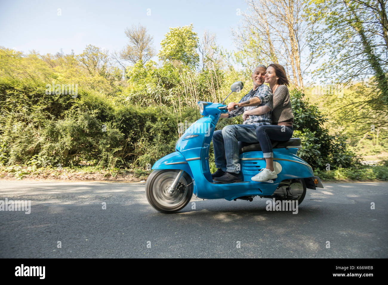 Woman riding scooter around city hi-res stock photography and images ...