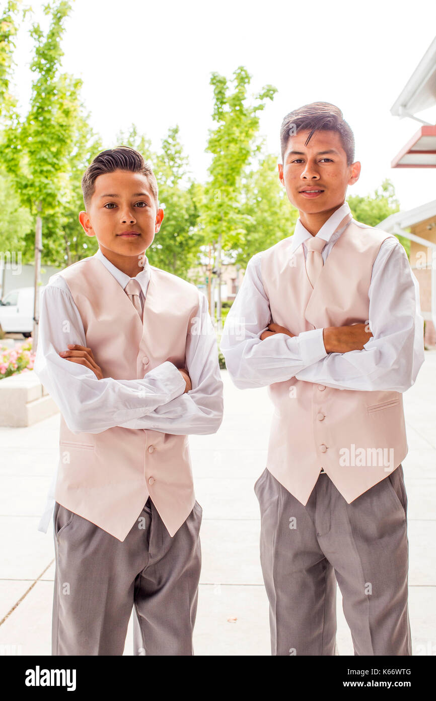 Portrait of confident Hispanic boys wearing suits Stock Photo - Alamy