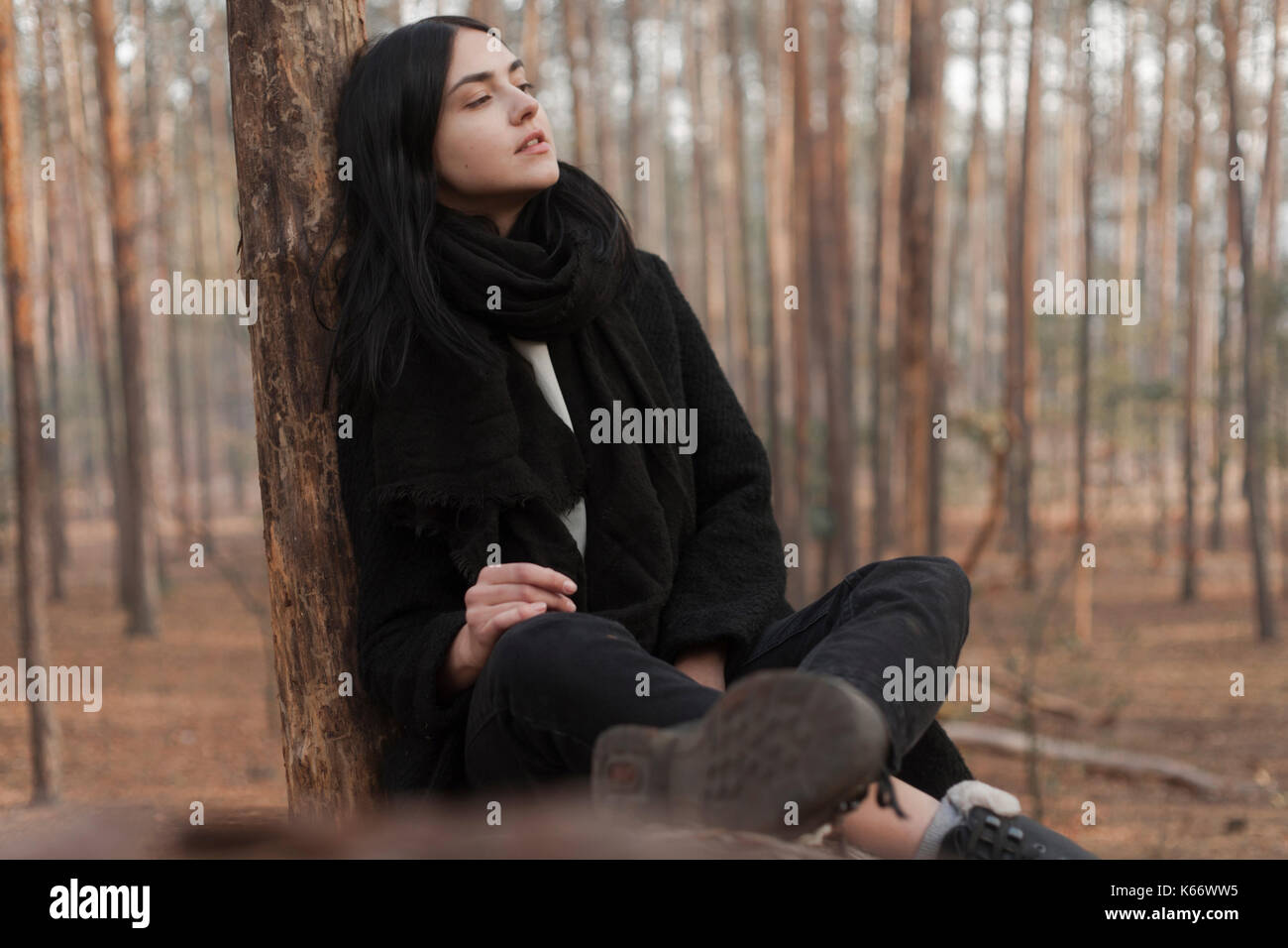 Caucasian woman sitting log wood hi-res stock photography and images ...