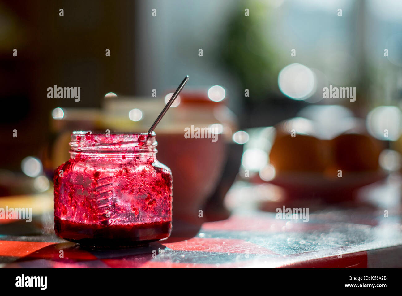 Spoon in jar of jam Stock Photo - Alamy