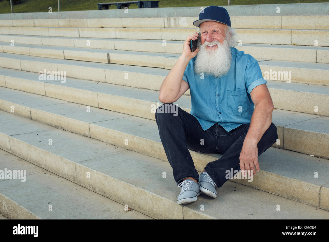 emotional senior man talking on the phone and laughing outdoor Stock ...