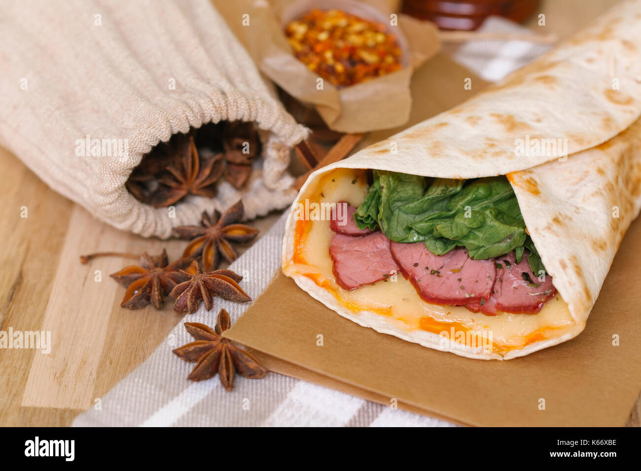Meat and melted cheese in wrap Stock Photo - Alamy