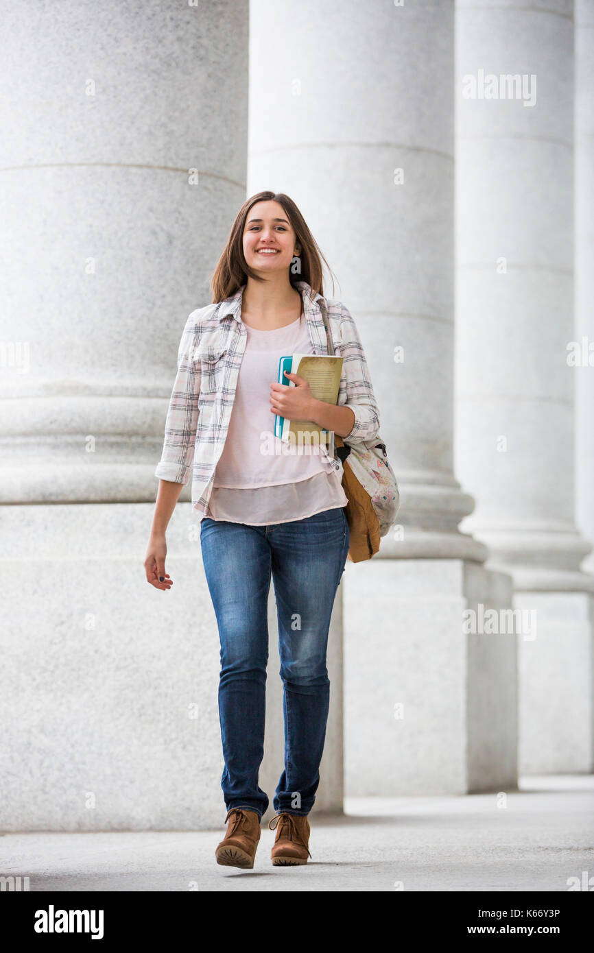 Woman carrying books hi-res stock photography and images - Alamy