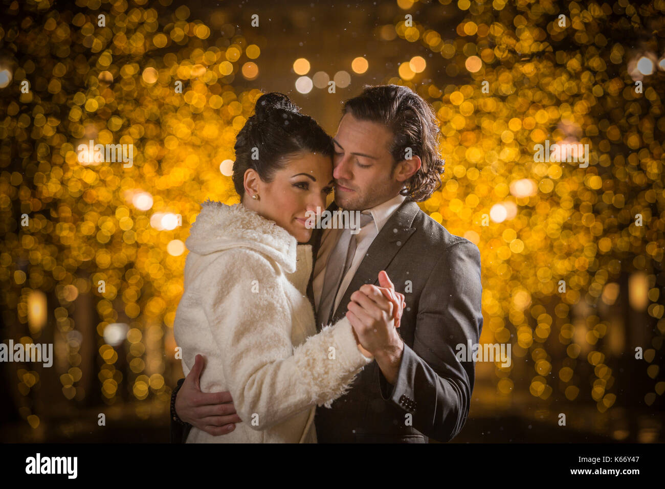 Caucasian couple dancing at night Stock Photo - Alamy