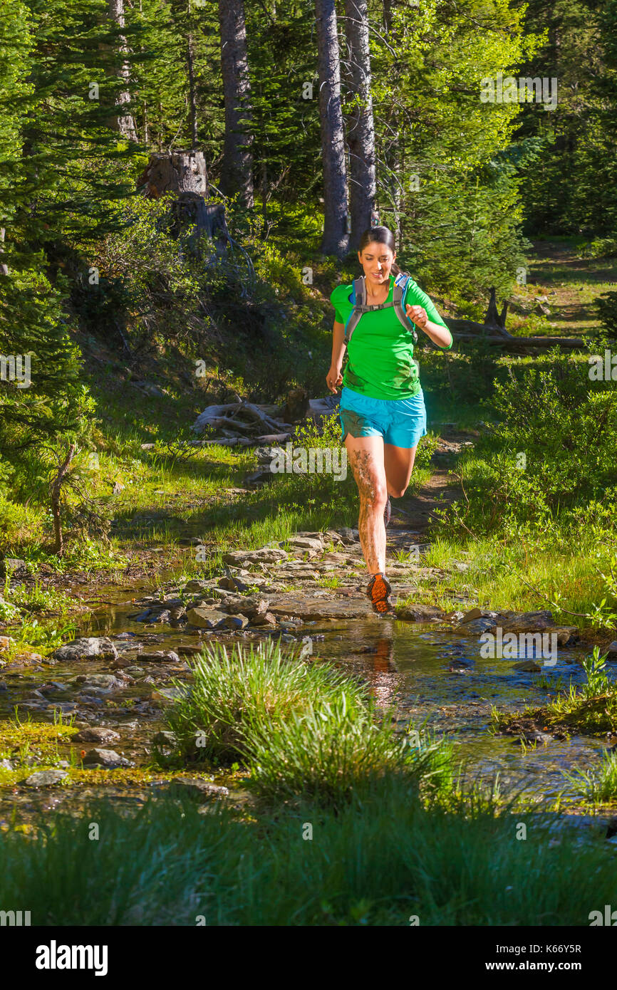 Woman trail running back pack hi-res stock photography and images - Alamy