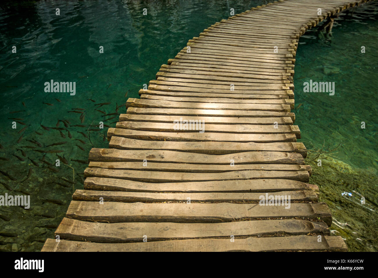 Wooden footbridge over water Stock Photo - Alamy