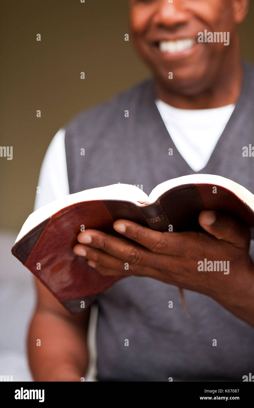 African man reading bible hi-res stock photography and images - Alamy