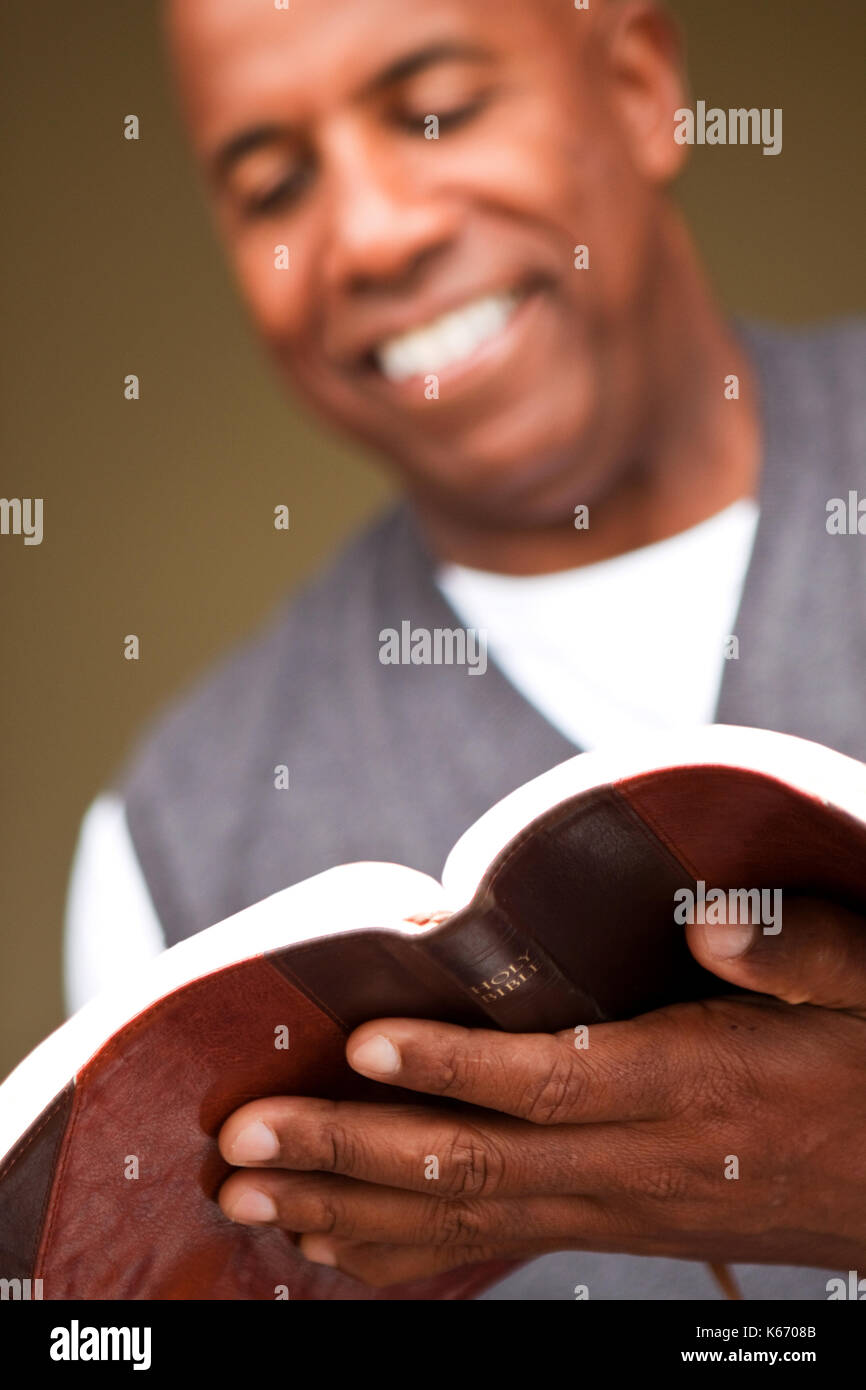 African man reading bible hi-res stock photography and images - Alamy