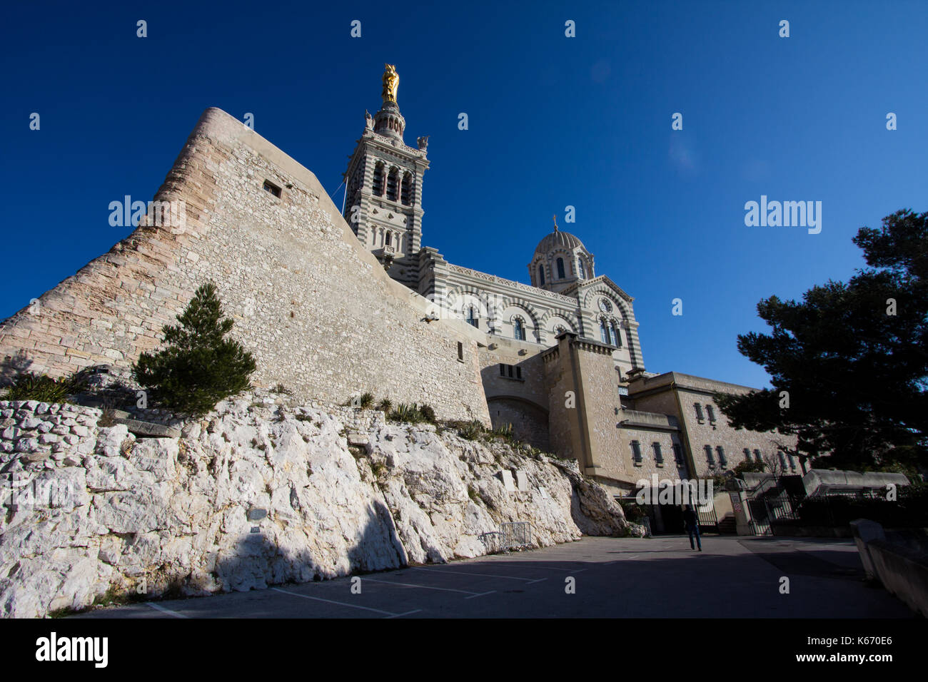 Basilique Notre Dame de la Garde shot from the lower seaside walkway on ...