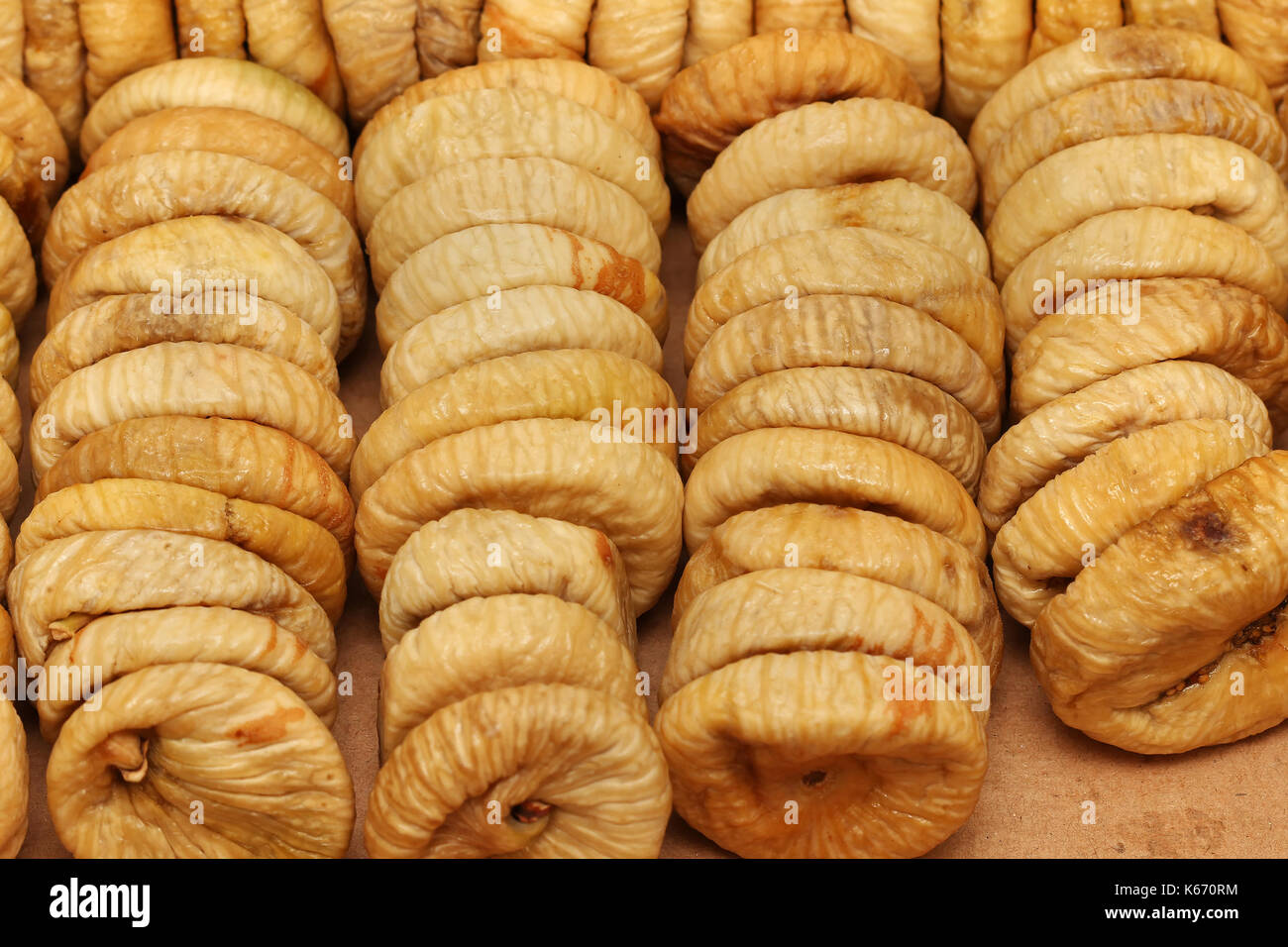 Organic fruit stack of brown dry figs Stock Photo - Alamy