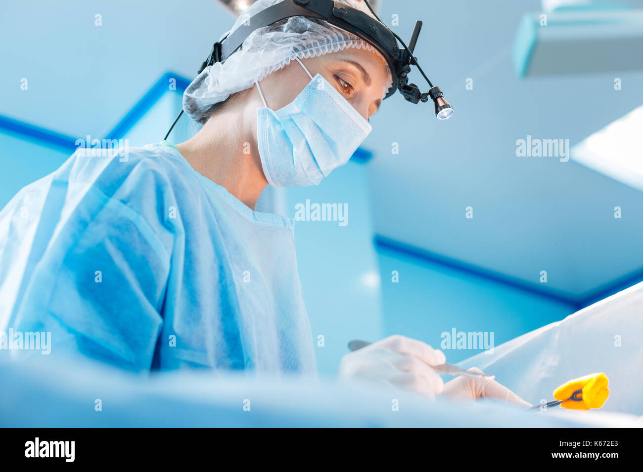 Portrait of serious practitioner that using operating knife Stock Photo ...