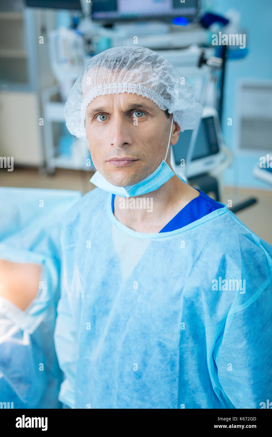 Handsome surgeon resting after operation Stock Photo - Alamy