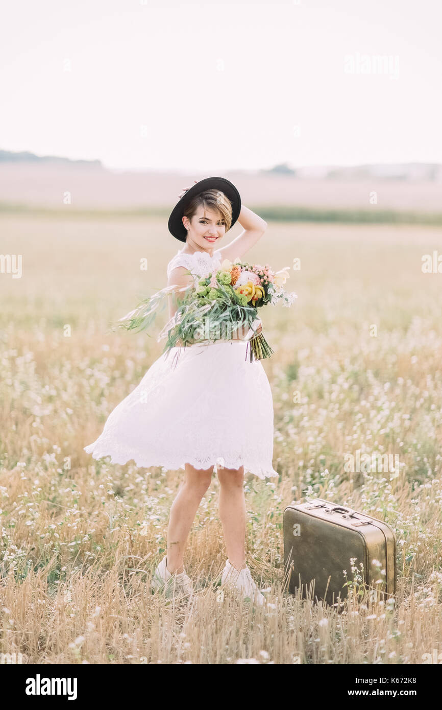 The lovely portrait of the smiling spinning bride in the vintage ...