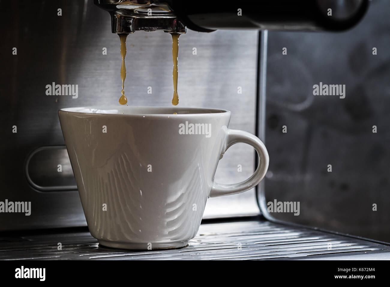 Dripping into white cup hi-res stock photography and images - Alamy