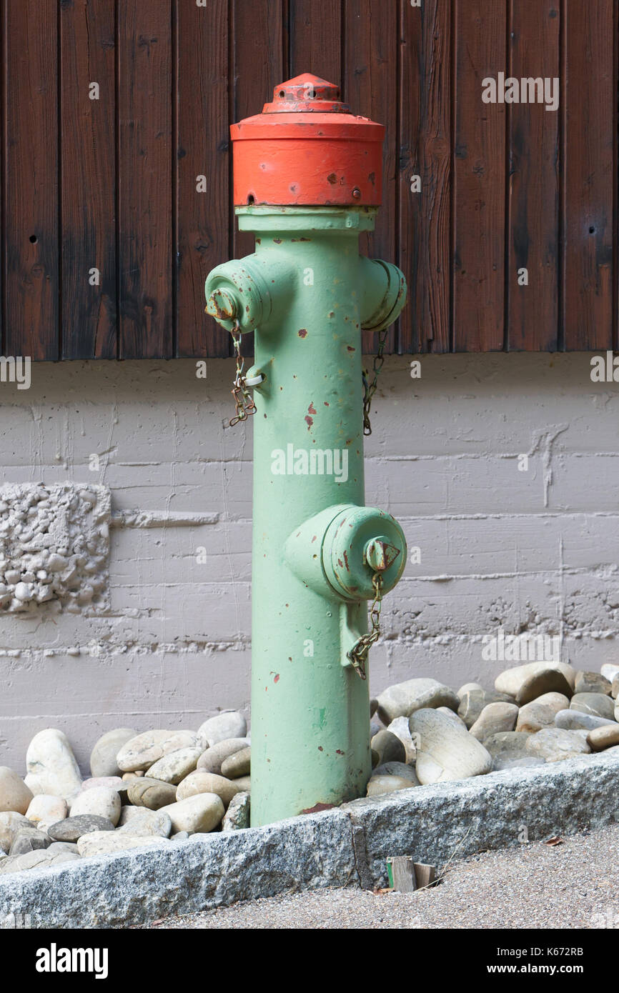 Green fire hydrant on a city sidewalk, Austria Stock Photo - Alamy