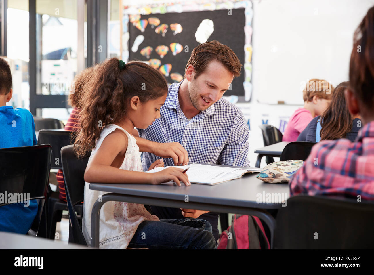 Schoolgirls in classroom students working hi-res stock photography and ...