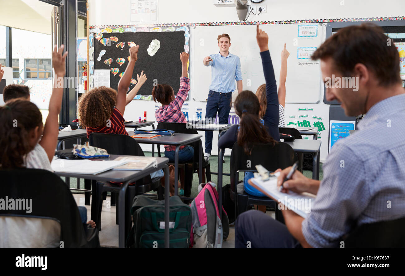 Trainee teacher learning how teach elementary students Stock Photo - Alamy