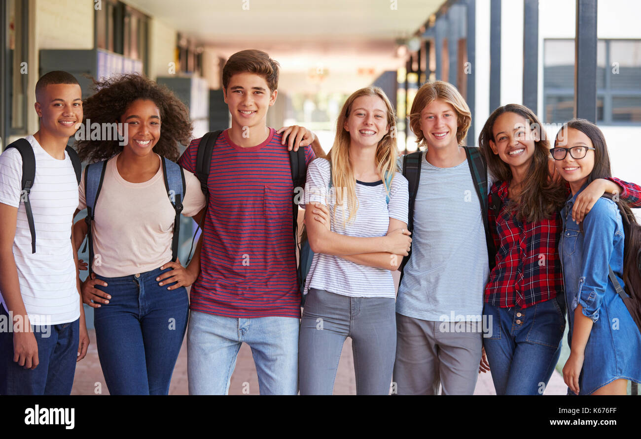 Teenage classmates standing in high school hallway Stock Photo - Alamy