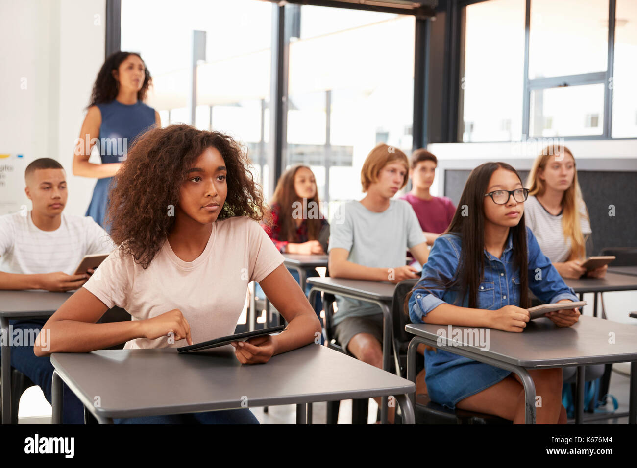 Teacher stands at the back of her high school class Stock Photo - Alamy