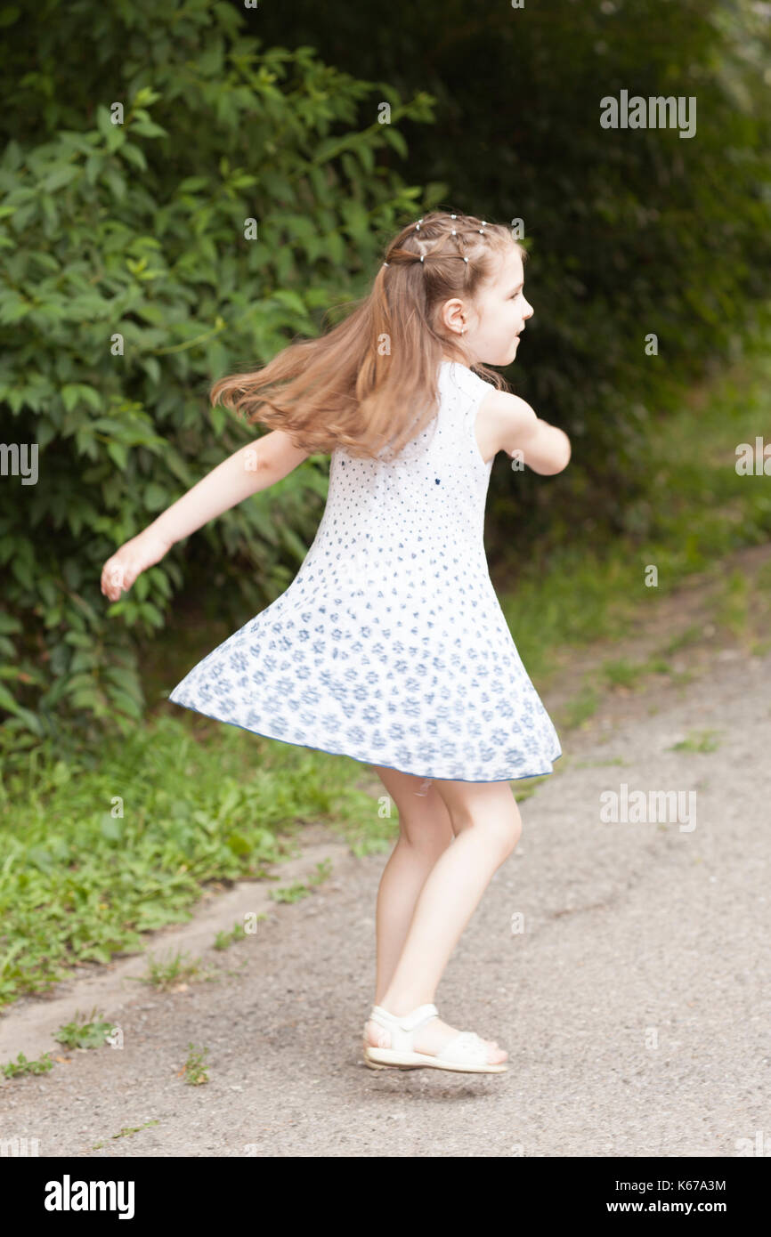 Girl spinning around Stock Photo - Alamy