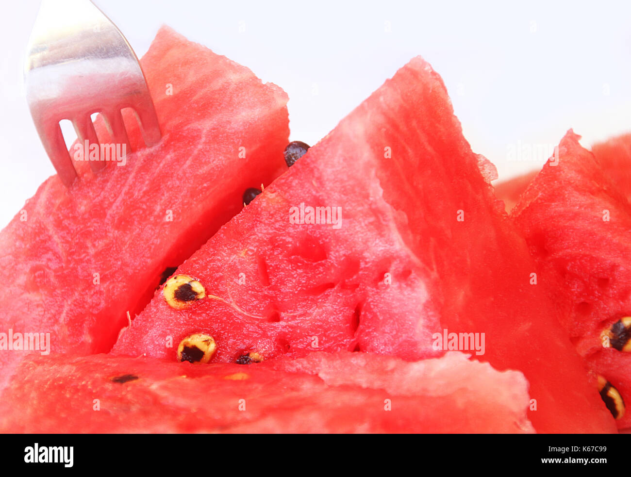 Fork in watermelon Stock Photo - Alamy