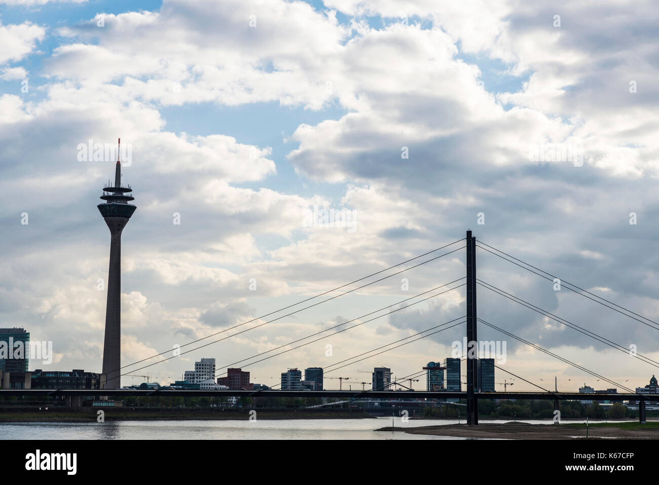 Skyline along the Rhine river with the telecommunications tower and the ...