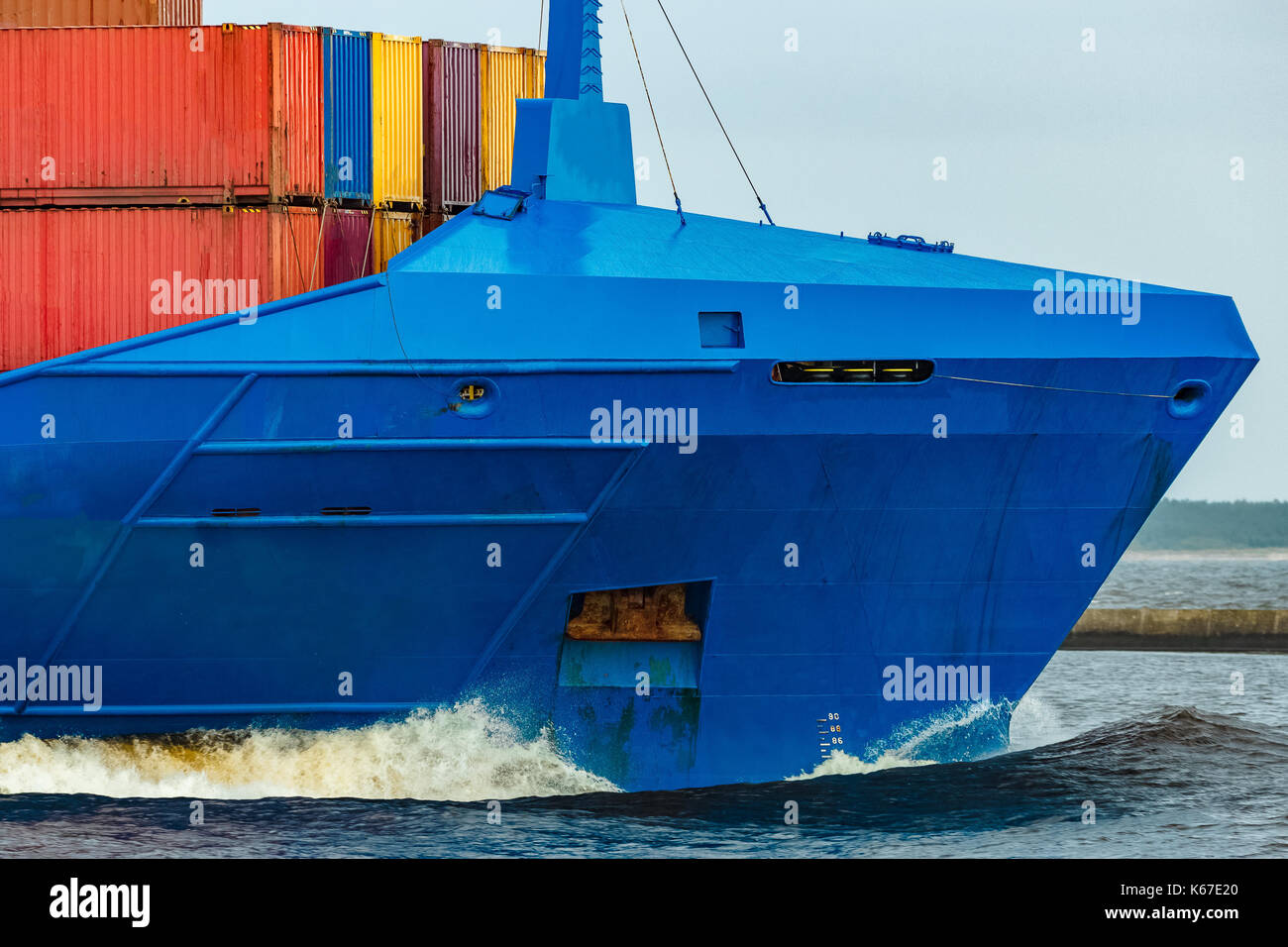 Blue cargo container ship fully loaded underway Stock Photo - Alamy