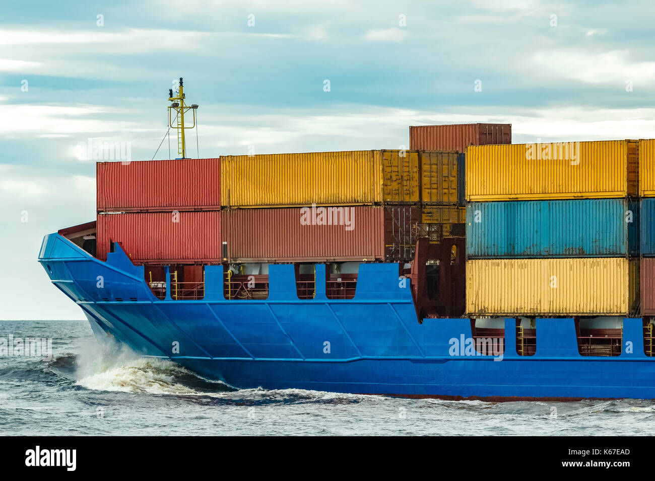 Blue cargo container ship fully loaded underway Stock Photo - Alamy