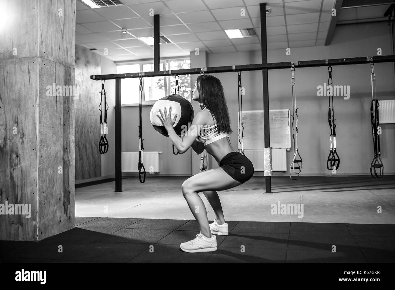 Woman training with functional gymnastic in the gym Stock Photo - Alamy