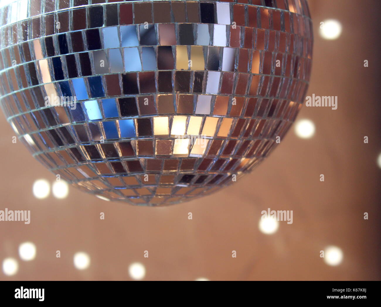 Silver disco ball with light reflections Stock Photo - Alamy