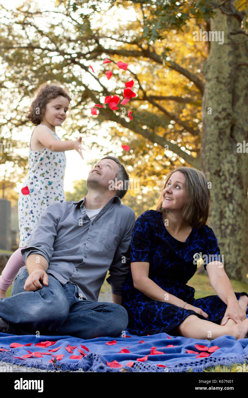 little girl throws roses on her parents Stock Photo - Alamy