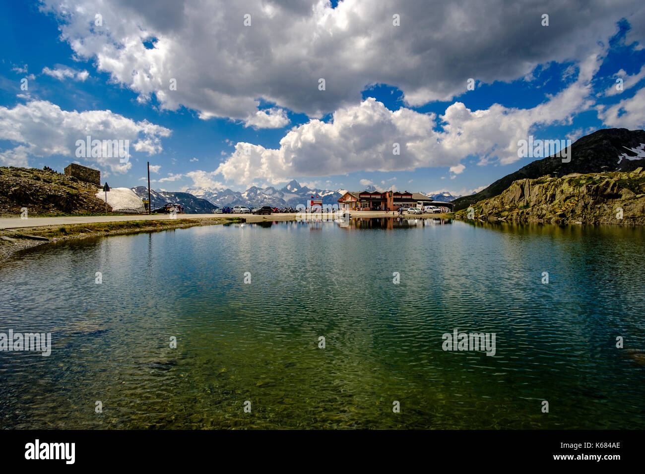 Landscape with the alpine hut and a lake on top of Nufenen Pass Stock ...