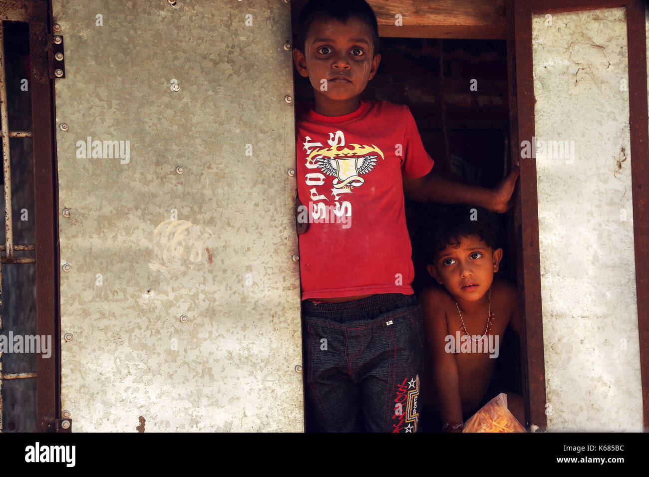 Unidentified Happy Indian rural child front of their house in village ...