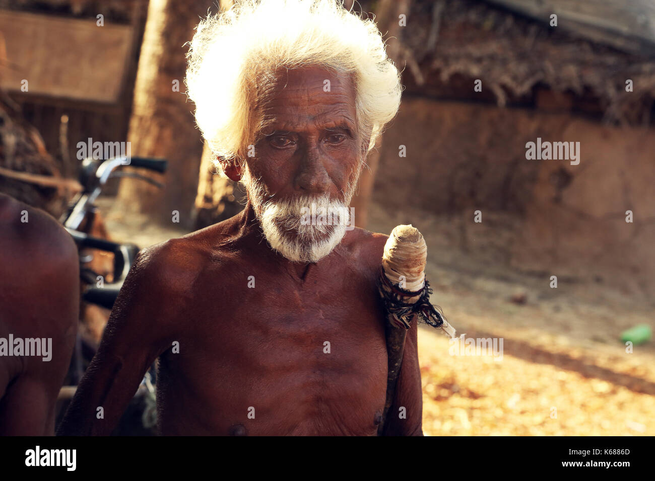 very sad old man at village Stock Photo - Alamy