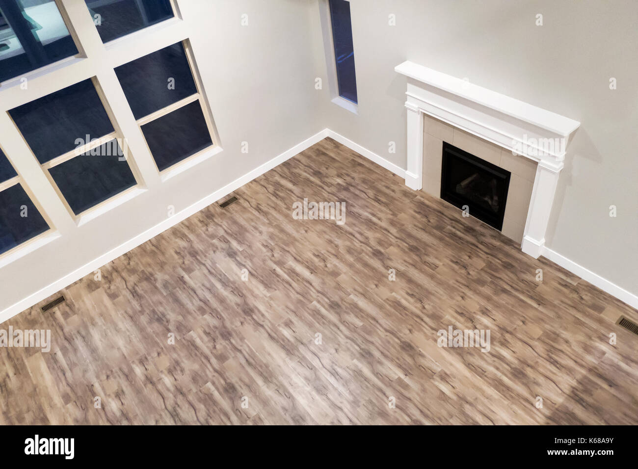 An overhead view of an empty living room with large open windows and a ...