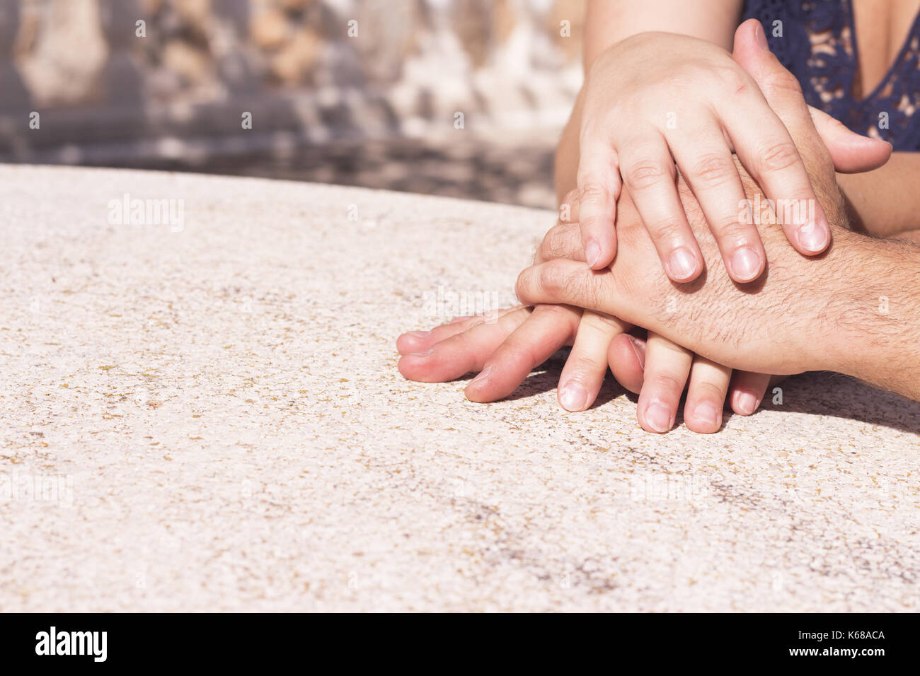 Intertwined hands young couple hi-res stock photography and images - Alamy