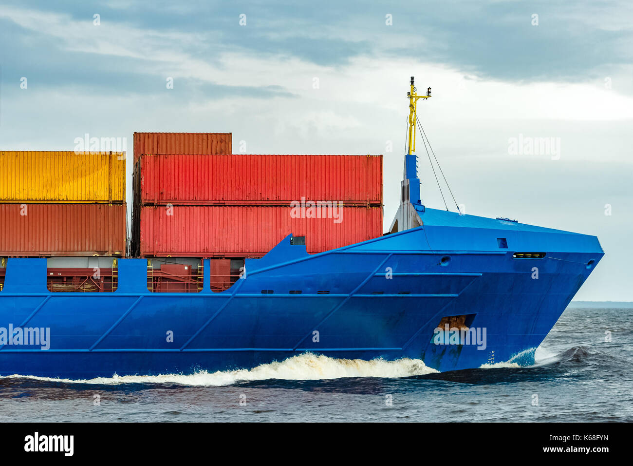 Blue cargo container ship fully loaded underway Stock Photo - Alamy