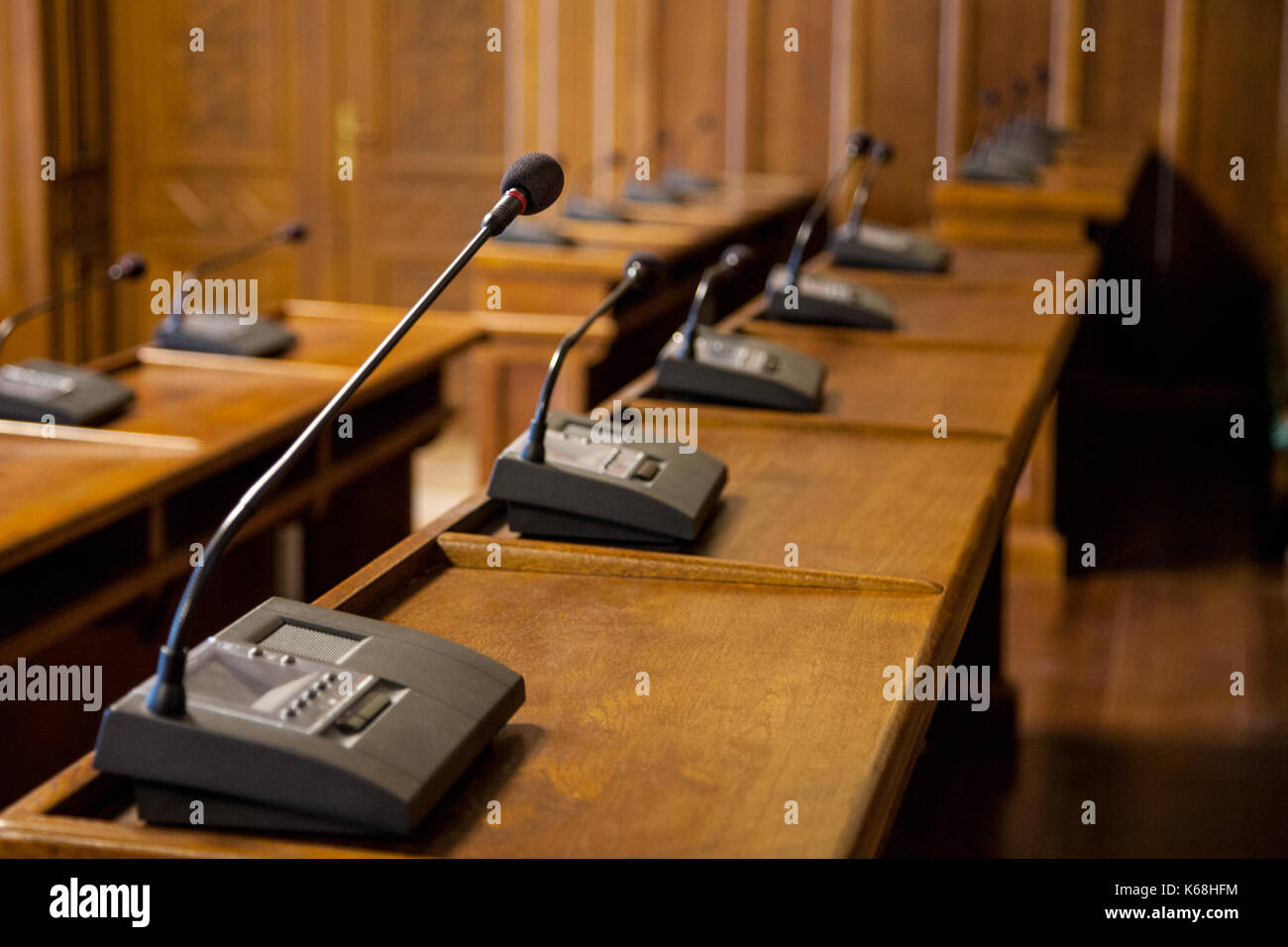 Close up on a microphone in a conference room of a municipal assembly ...