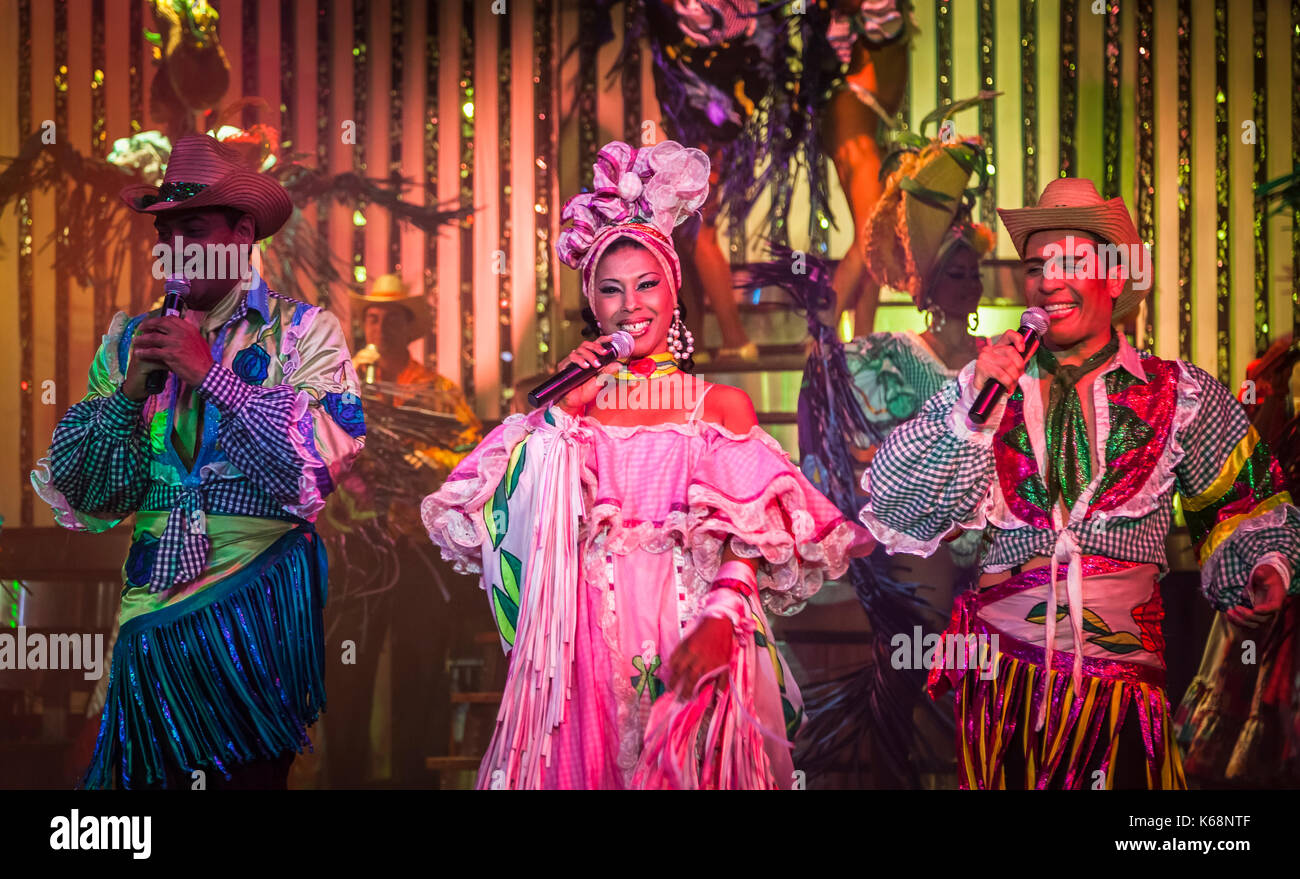 Local exotic dancers performing live on stage in colourful costumes in ...