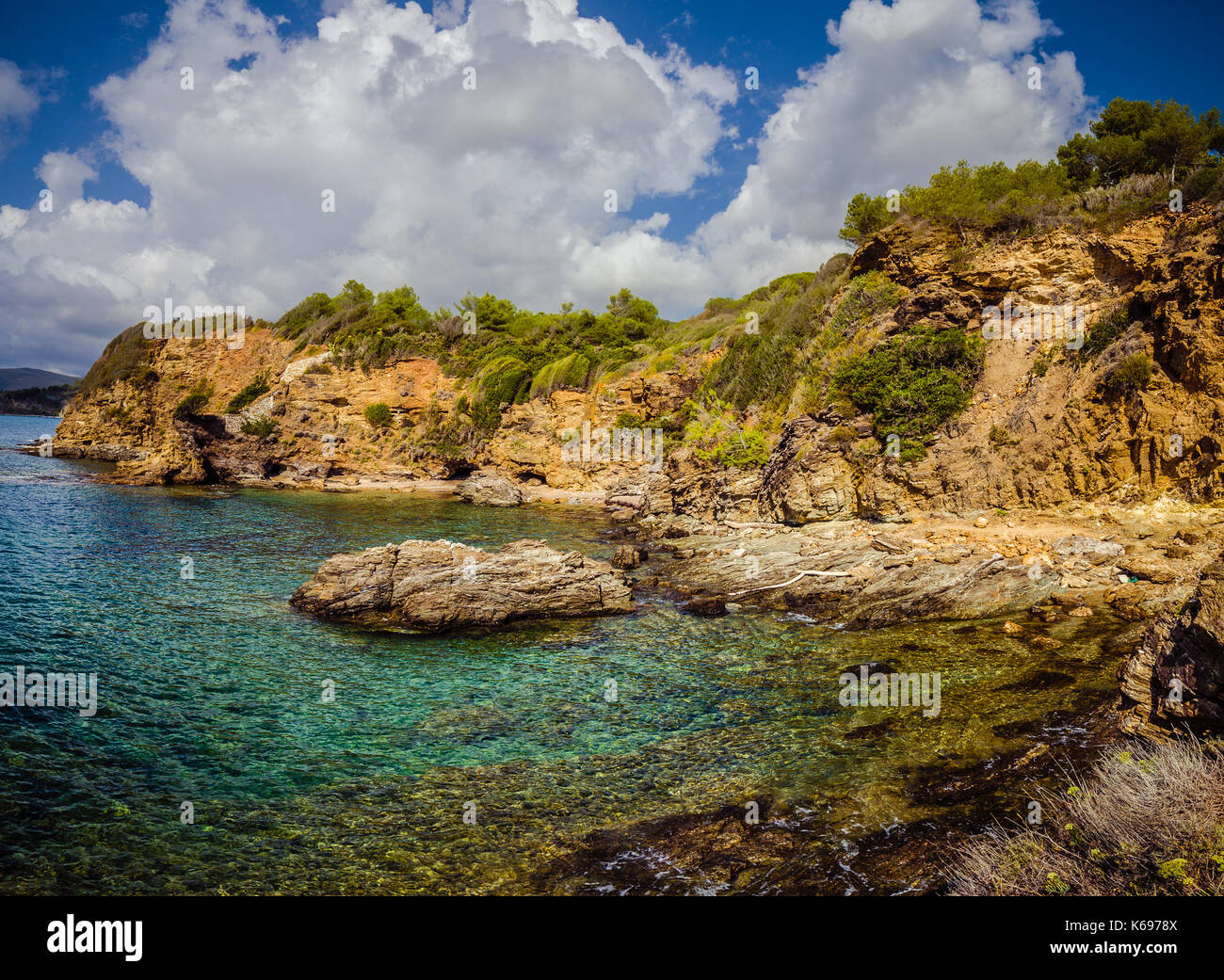 exciting panorama of clear and blue sea of Island of Elba under the sun ...
