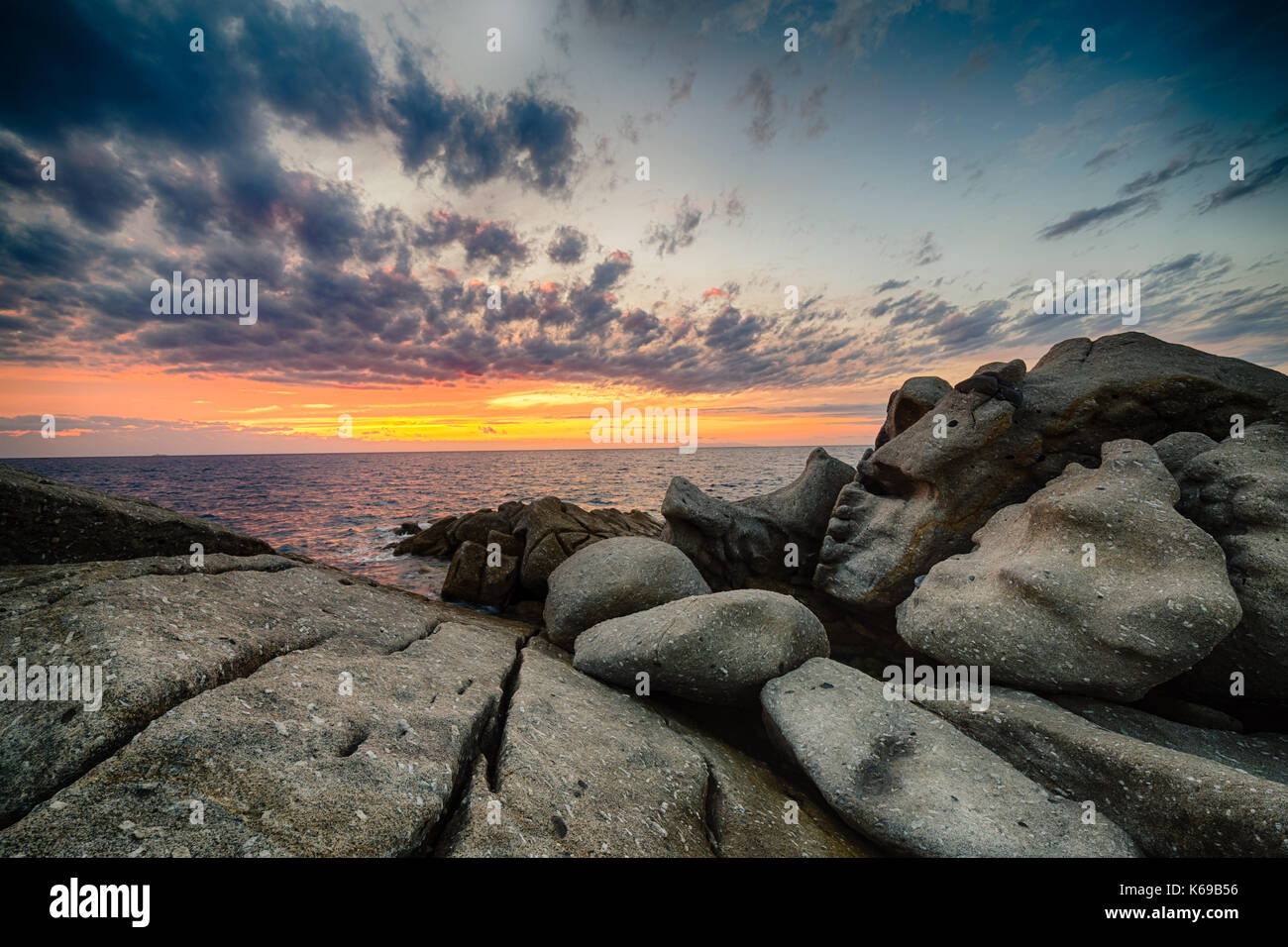 Scenic coastal sunset with orange light on island of Elba Stock Photo ...